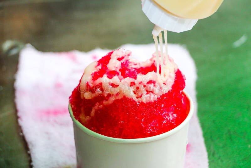 Red Shaved Ice that is Clear Condensed Milk is Hot in the Summer Stock ...