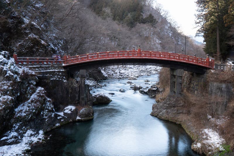 Red bridge in the snow stock photo. Image of trees, people - 17586132