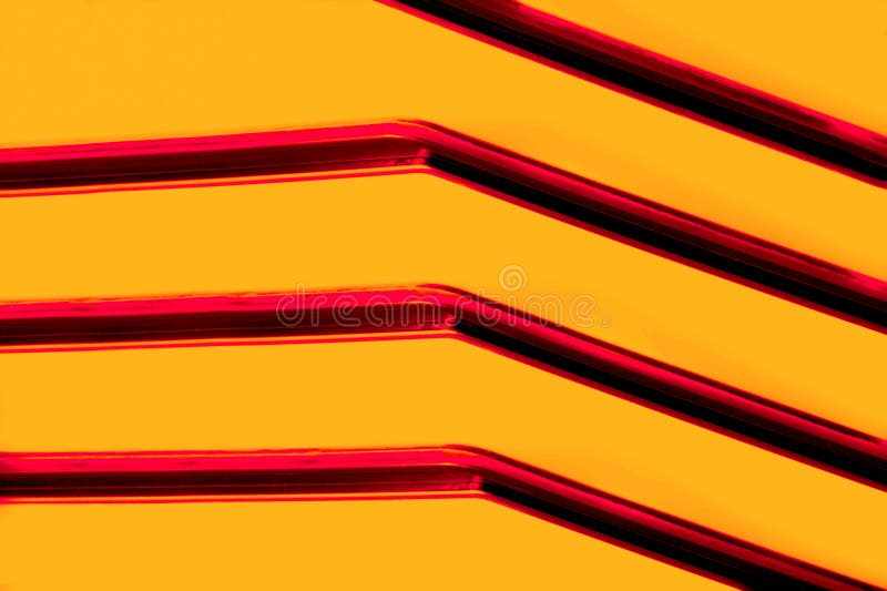 Red Shiny Bent Bars on a Bright Yellow Background. Stock Photo - Image ...