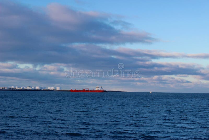 Red ship at sea stock photo. Image of water, easy, cloudy - 105355676