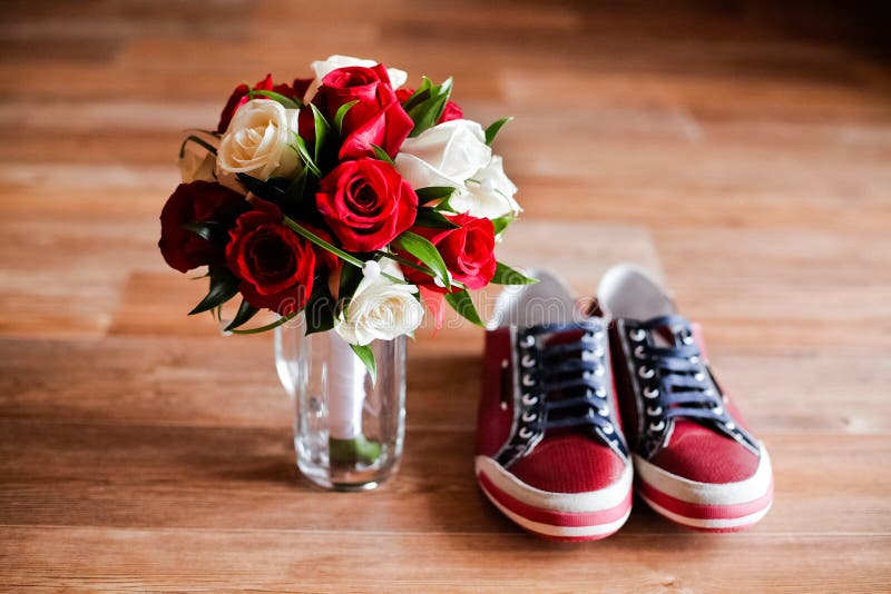 Red Shoes on a Brown Floor with Bouquet of Roses Stock Image - Image of ...