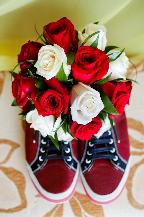 Red Shoes on a Brown Floor with Bouquet of Roses Stock Photo - Image of ...