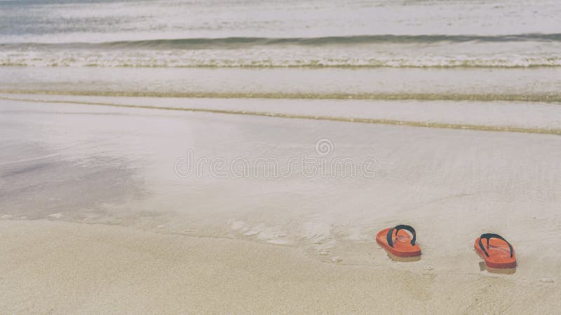 Red Shoes on the Sandy Beach with Sea Water and Waves Stock Photo ...