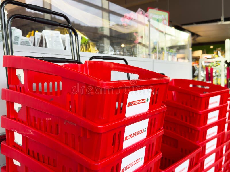 Red Shopping Interspat Baskets Stacked in Grocery Store Aisle Editorial ...