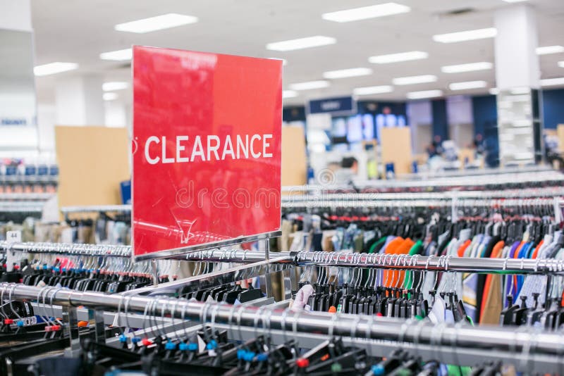 Sale Clearance Sign on Rail in Clothes Shop Stock Image - Image of sign ...