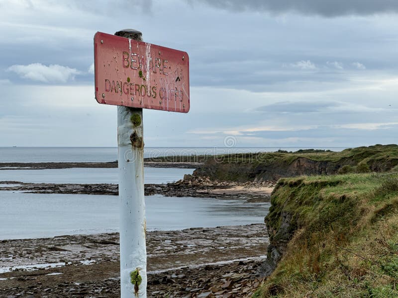 Red Sign or Post or Signpost with White Letters Saying Beware ...