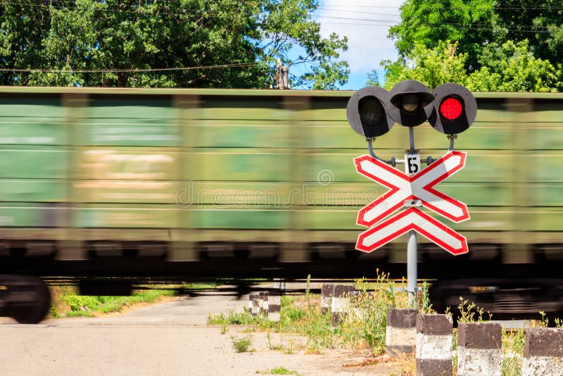 Red Signal of Semaphore and Stop Sign in Front of Railroad Crossing ...