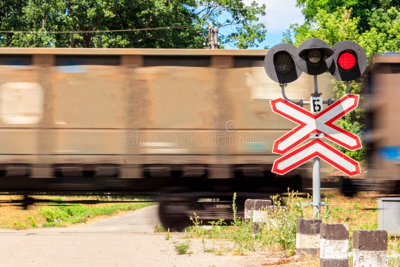 Red Signal of Semaphore and Stop Sign in Front of Railroad Crossing ...
