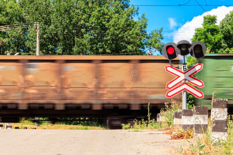 Red Signal of Semaphore and Stop Sign in Front of Railroad Crossing ...