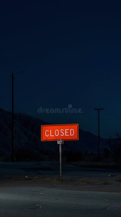 Red Signpost with the Words Closed Against the Night Landscape Backdrop ...