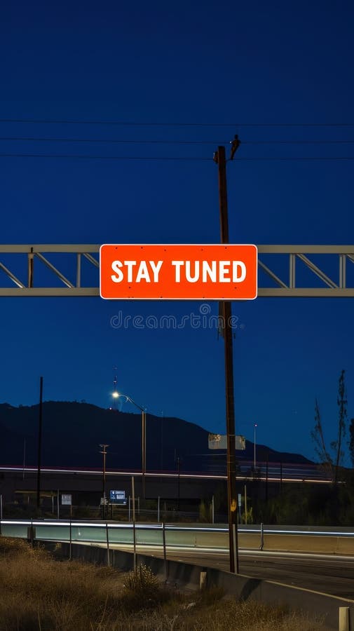 Red Signpost with the Words Stay Tuned Against the Night Landscape ...