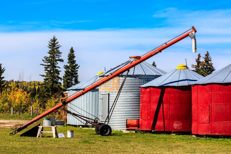 A Red Silo with a Silver Crane Attached To it Stock Image - Image of ...