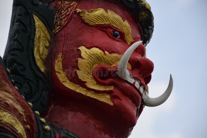 The Red-skinned Giant Statue Standing with a Baton Stock Image - Image ...