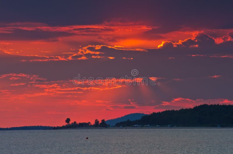 Red Sky at Sunset Over Sea with Small Cape in Background, Sithonia ...