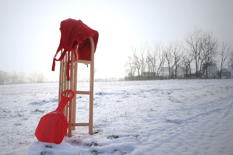 Red Sledge and Warm Trousers in Snow Landscape Stock Photo - Image of ...