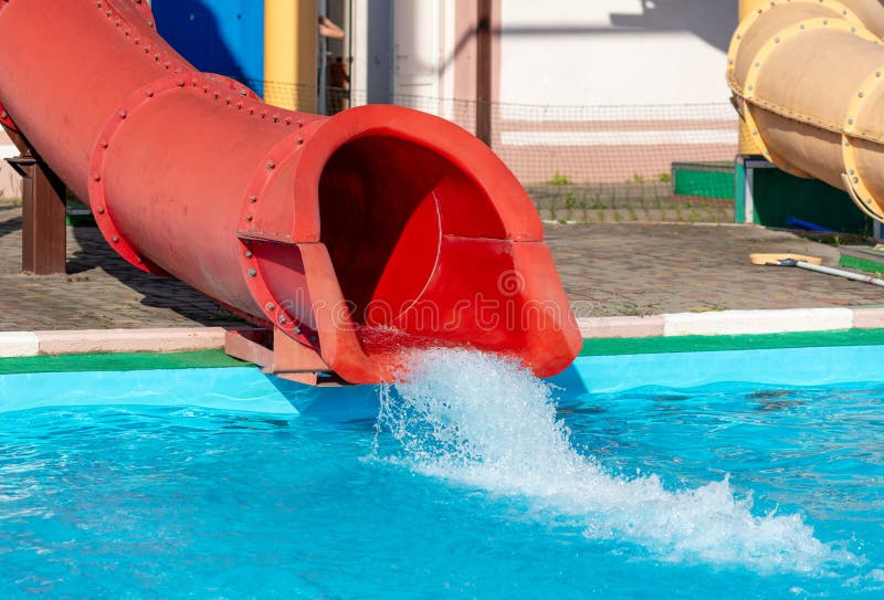 Red Slide in the Pool of the Water Park Stock Photo - Image of slide ...