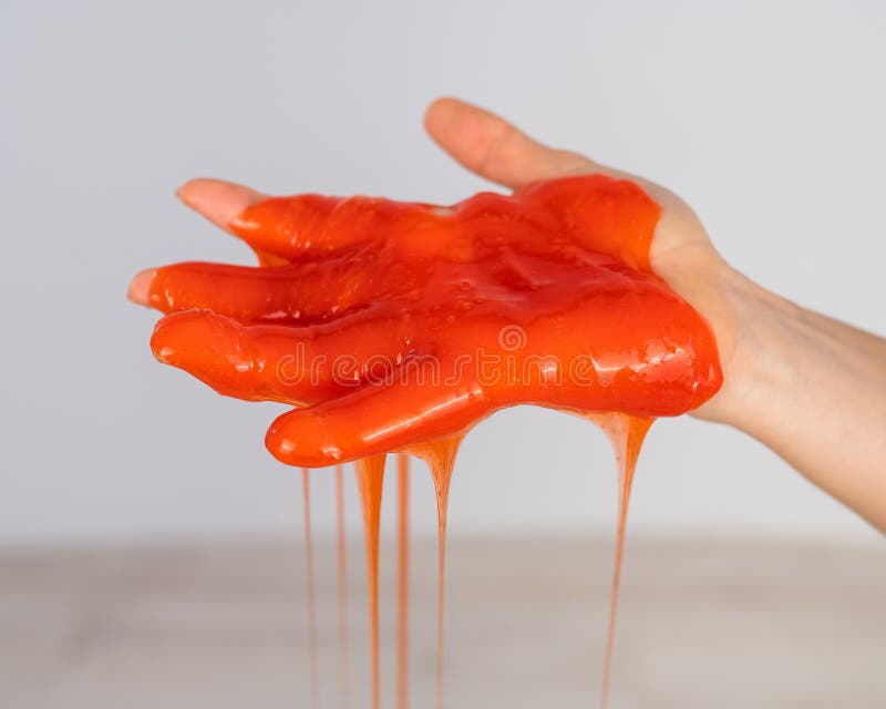 Red Slime Flowing Down from a Woman& X27;s Hand on a White Background ...