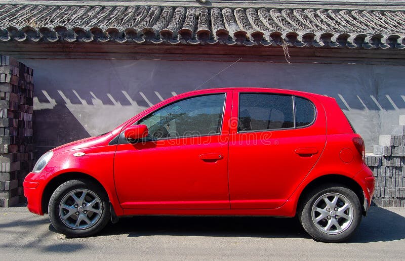 Red small car and wall stock photo. Image of architecture - 5255448