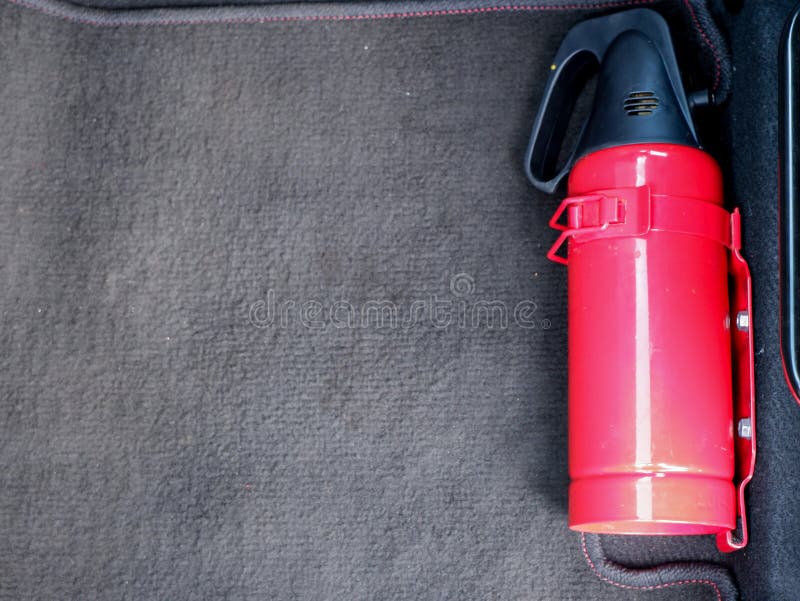 Red Small Fire Extinguisher in the Car for Safety and Prevent Fire ...