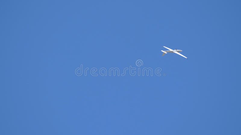 Red Small Sport Plane Flying in the Sky Pulls on a Rope the Glider ...