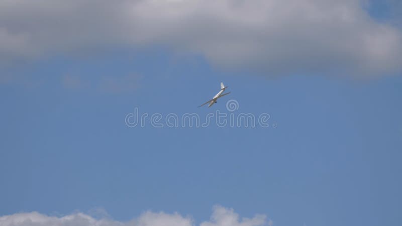 Red Small Sport Plane Flying in the Sky Pulls on a Rope the Glider ...