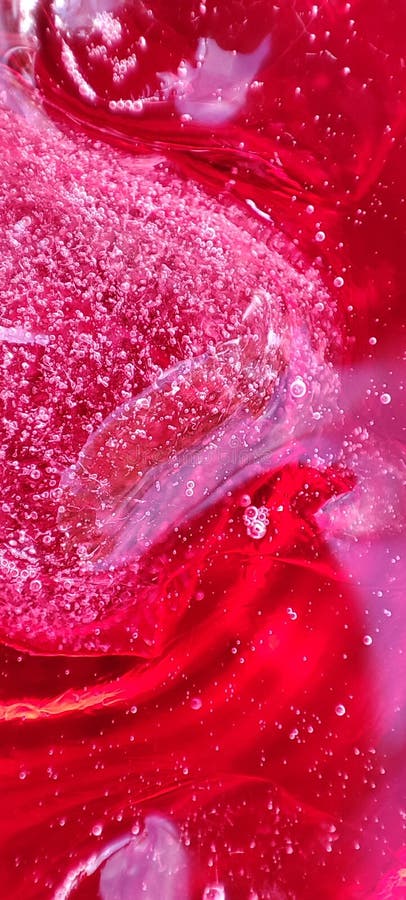 Red smooth liquid with ice stock image. Image of macro - 263470399