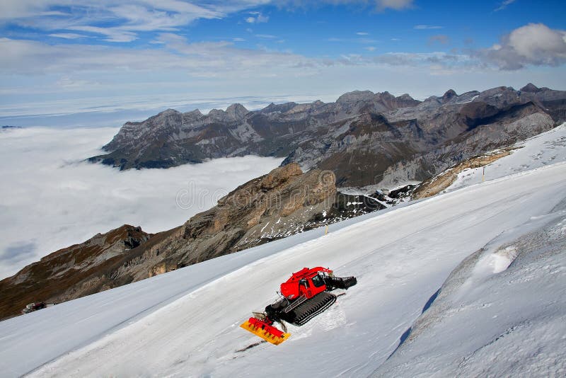 A Red Snow-plow on Snow Mountain. Stock Image - Image of clear ...