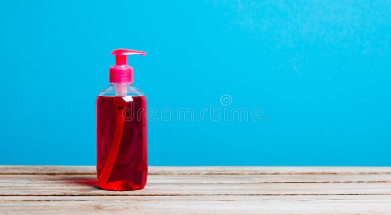Red Soap in Pump Bottle Container Over Blue Background Stock Image ...