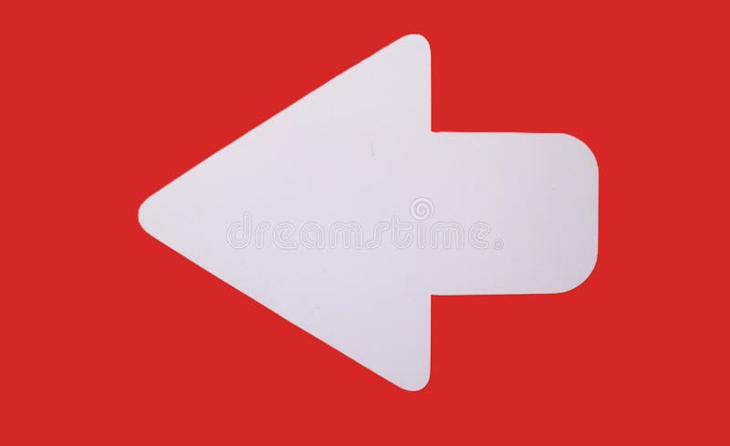A Large White Arrow Pointing Left on a Red Background. Stock Photo ...