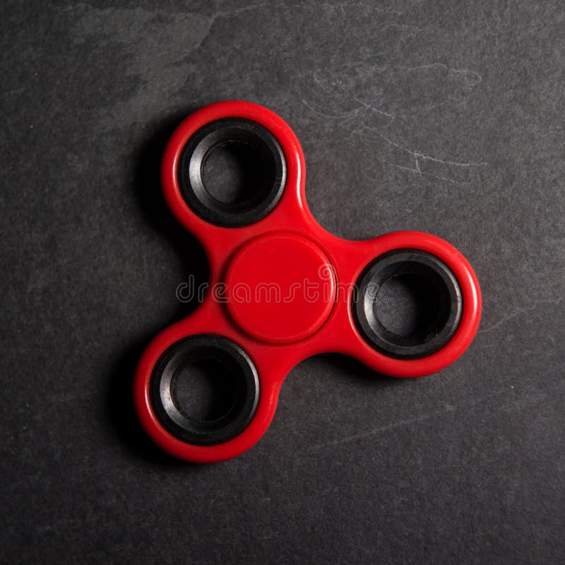Red Spinner Fidget Finger Stress Anxiety Relief Toy. Stock Photo ...