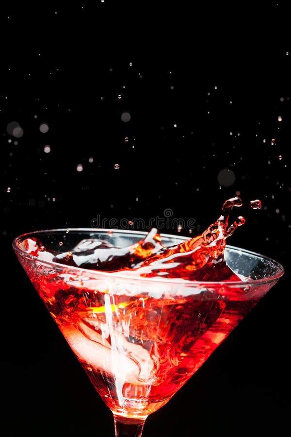 Red splashing cocktail stock image. Image of birthday - 14145335