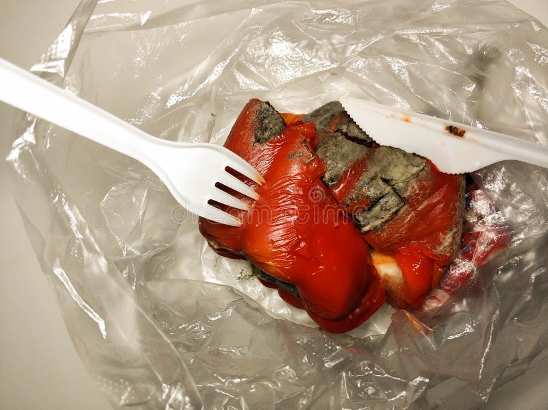 Red Spoiled Peppers in a Bag with a Plastic Knife and Fork. Problems of ...