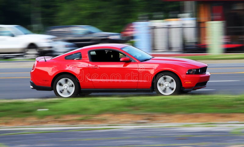 Red car in motion stock image. Image of driveway, fast - 20629227