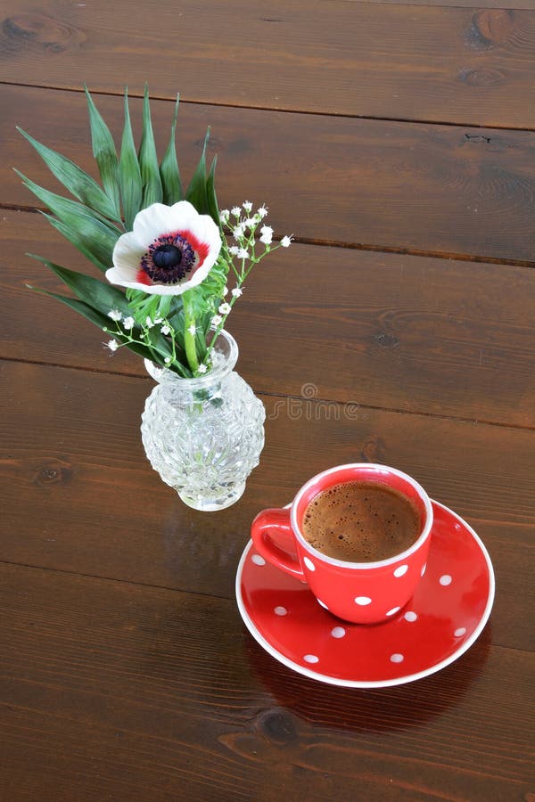 Red spotty mug and anemone stock image. Image of anemone - 38779323
