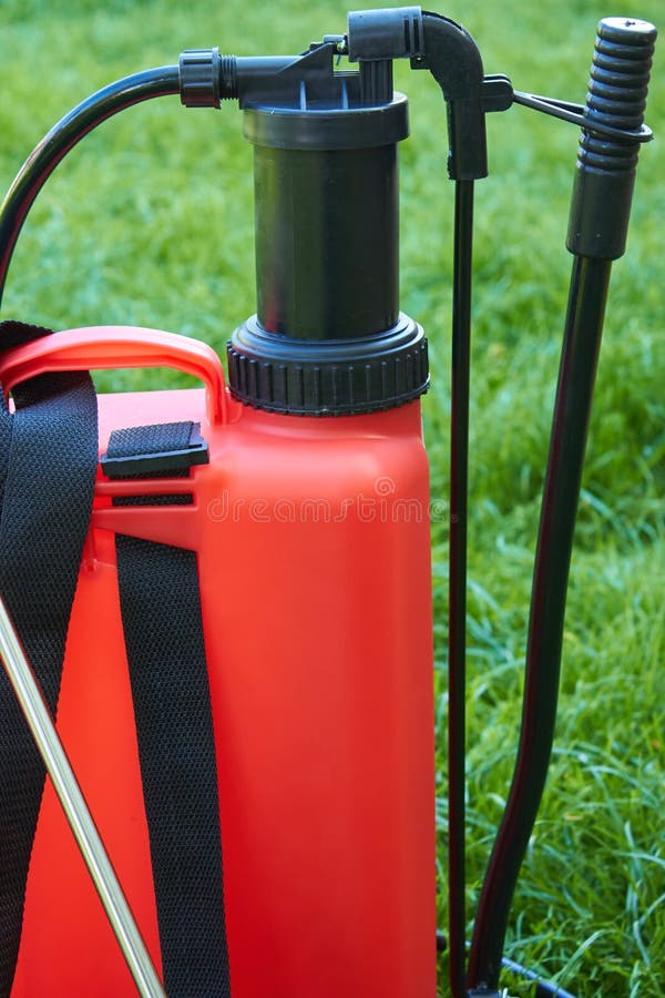 Red Sprayer for Insecticides,sprayer with Hand Pump Close Up on Grass ...