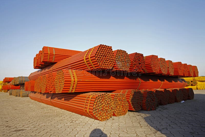 Red stacked steel pipe stock photo. Image of drainage - 224374680