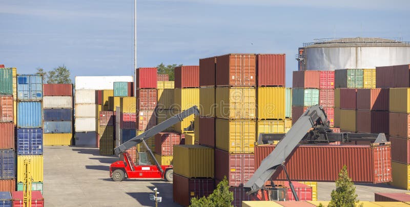 The Red Stacker Stacks Shipping Containers at the Port Warehouse ...