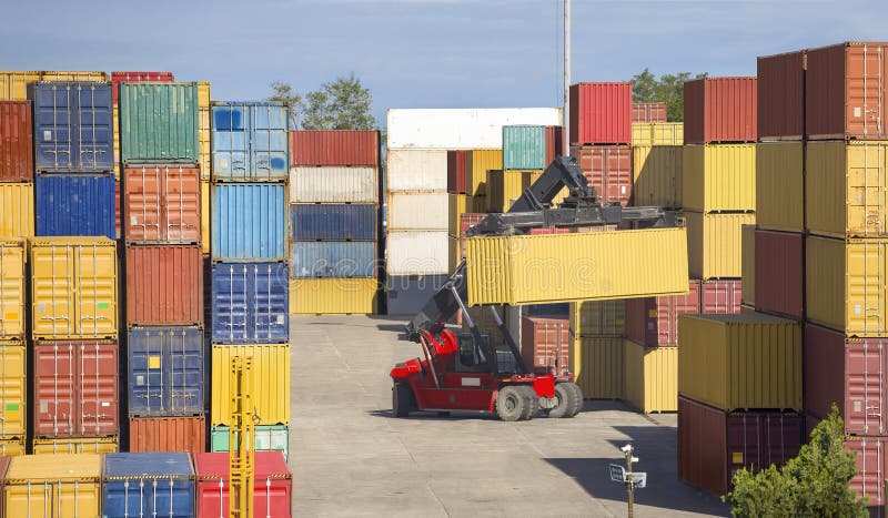 The Red Stacker Stacks Shipping Containers at the Port Warehouse ...