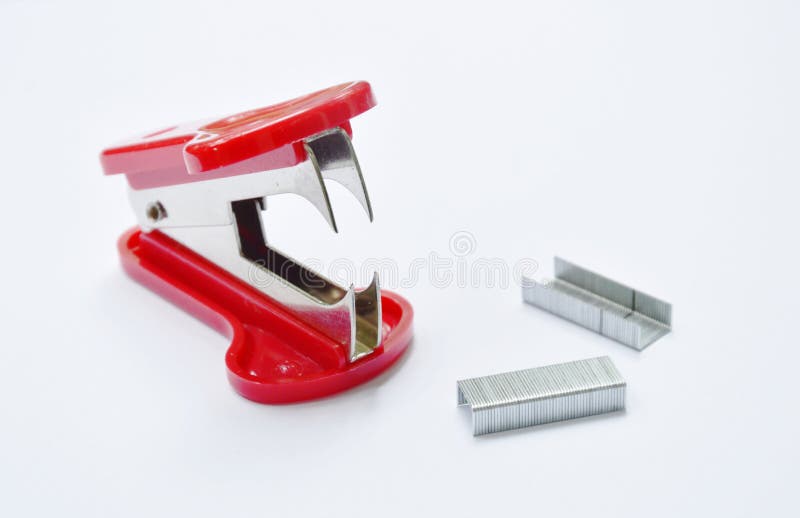 Red Staple Remover and Refill on White Table Stock Photo - Image of ...