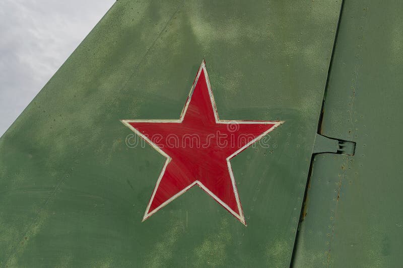 Red star on green fuselage stock image. Image of weathered - 360373321