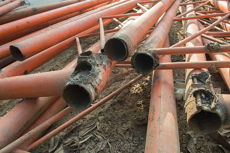 Red Steel Pipes in Warehouse. Stock Image - Image of industrial, pile ...