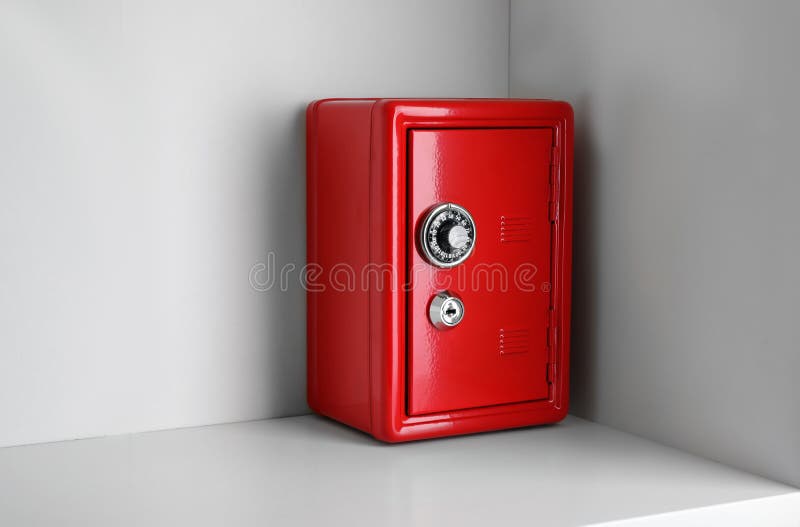 Red Safe with Mechanical Combination Lock on Shelf Stock Photo - Image ...