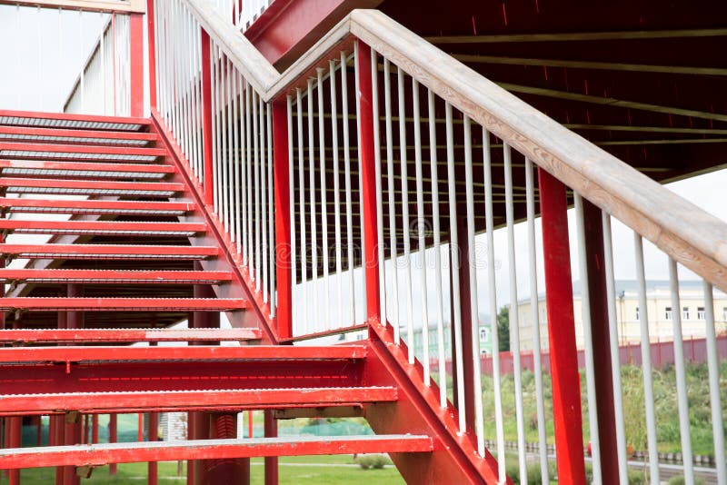 Red Steps of a Metal Staircase on the Street. in Cloudy Weather Stock ...