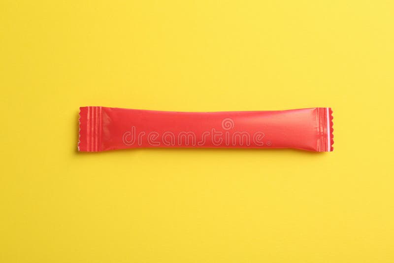 Red Stick of Sugar on Yellow Background, Top View Stock Photo - Image ...