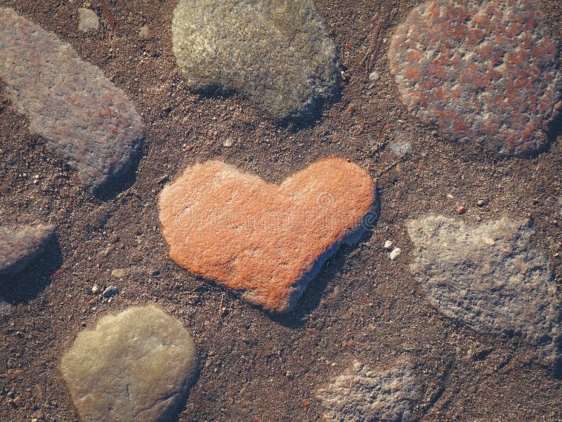 Red Stone Heart on Paved with Big Rocks Road Stock Image - Image of ...