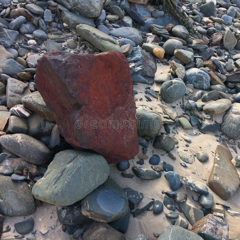 Red Stone, Unusual Stone, Stand Out from the Crowd Stock Photo - Image ...