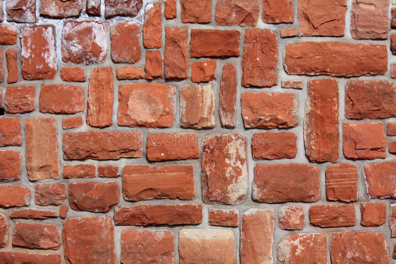 Red stone wall stock image. Image of fissure, lines, crack - 13357565