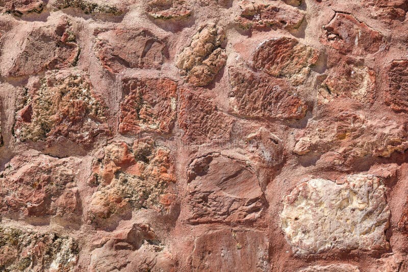 Red stone wall background stock photo. Image of stonewall - 90125402