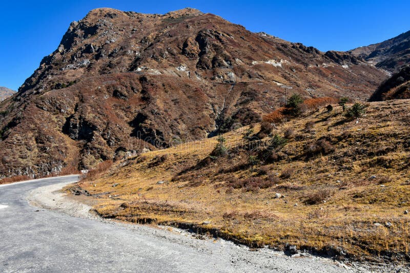Red Stony Cliff with Red Bushes and Blue Sky. Stock Photo - Image of ...