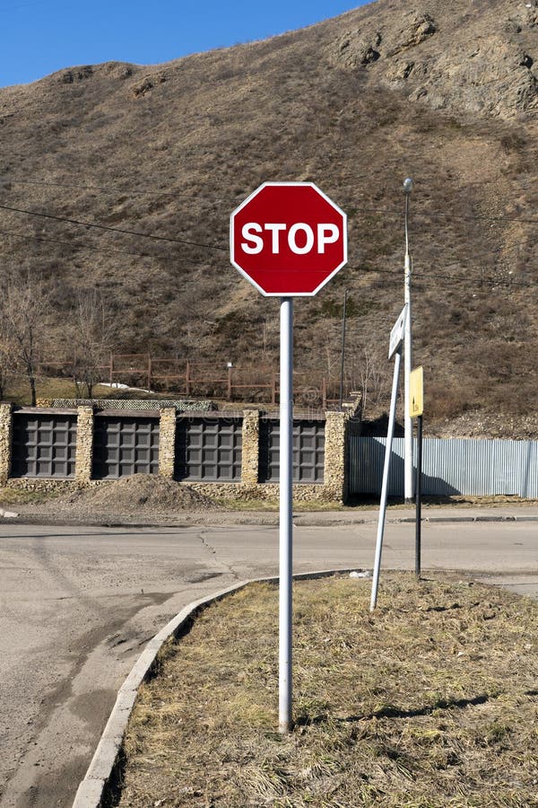 Red Stop Road Sign at the Corner of an Intersection. Stock Photo ...